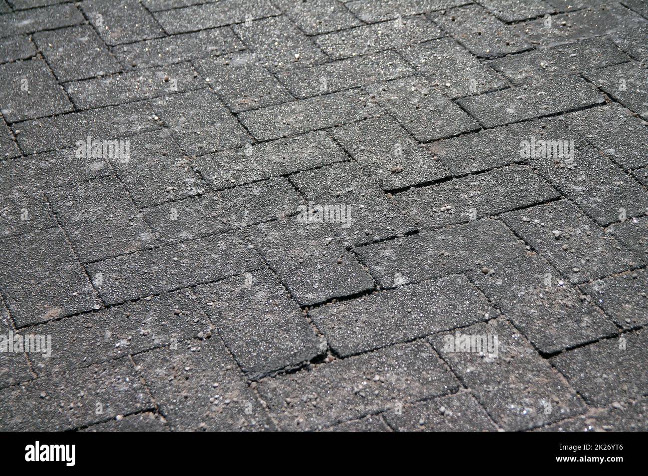 Crystals of salt to prevent the ice on a concrete pavement in a ...