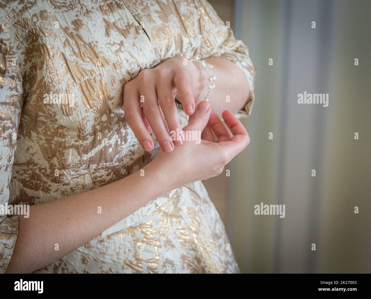 Woman wearing bracelets hi-res stock photography and images - Alamy