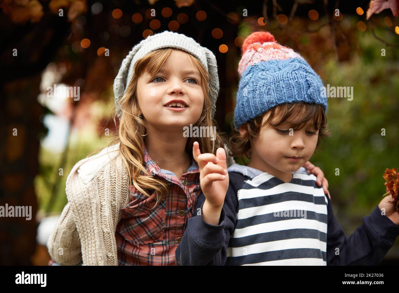 Playtime in the garden. two cute kids playing in the garden on an ...