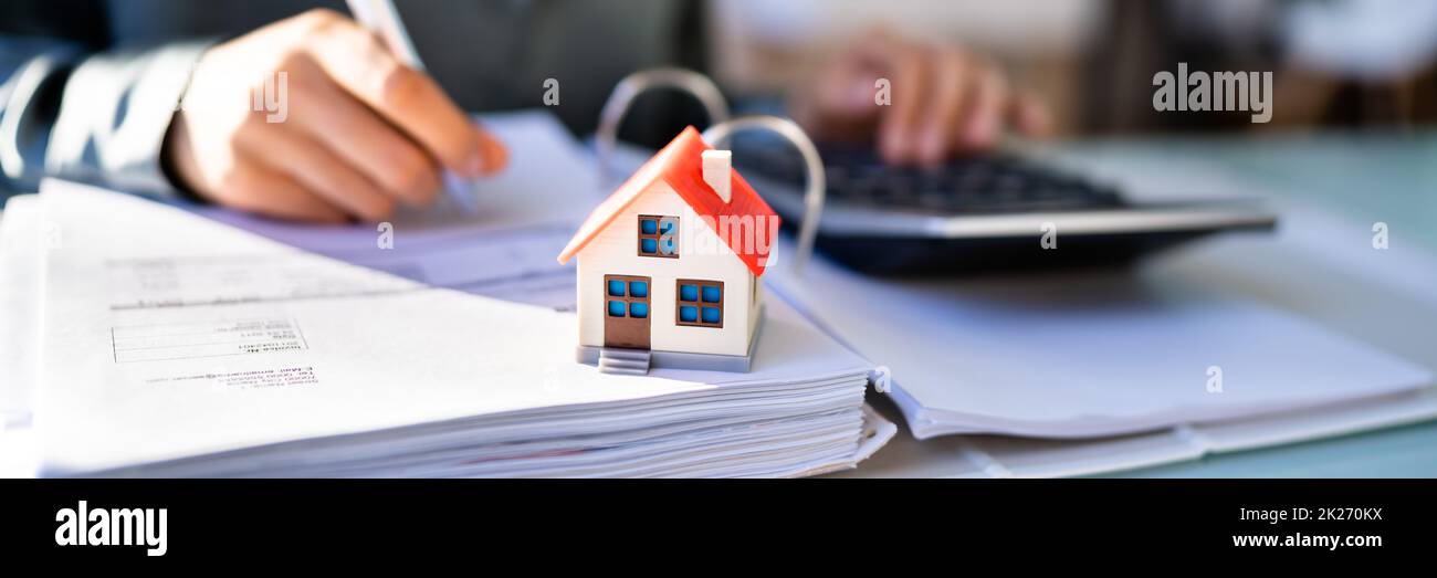 Person Hand Doing Property Tax Calculation Using Calculator Stock Photo ...