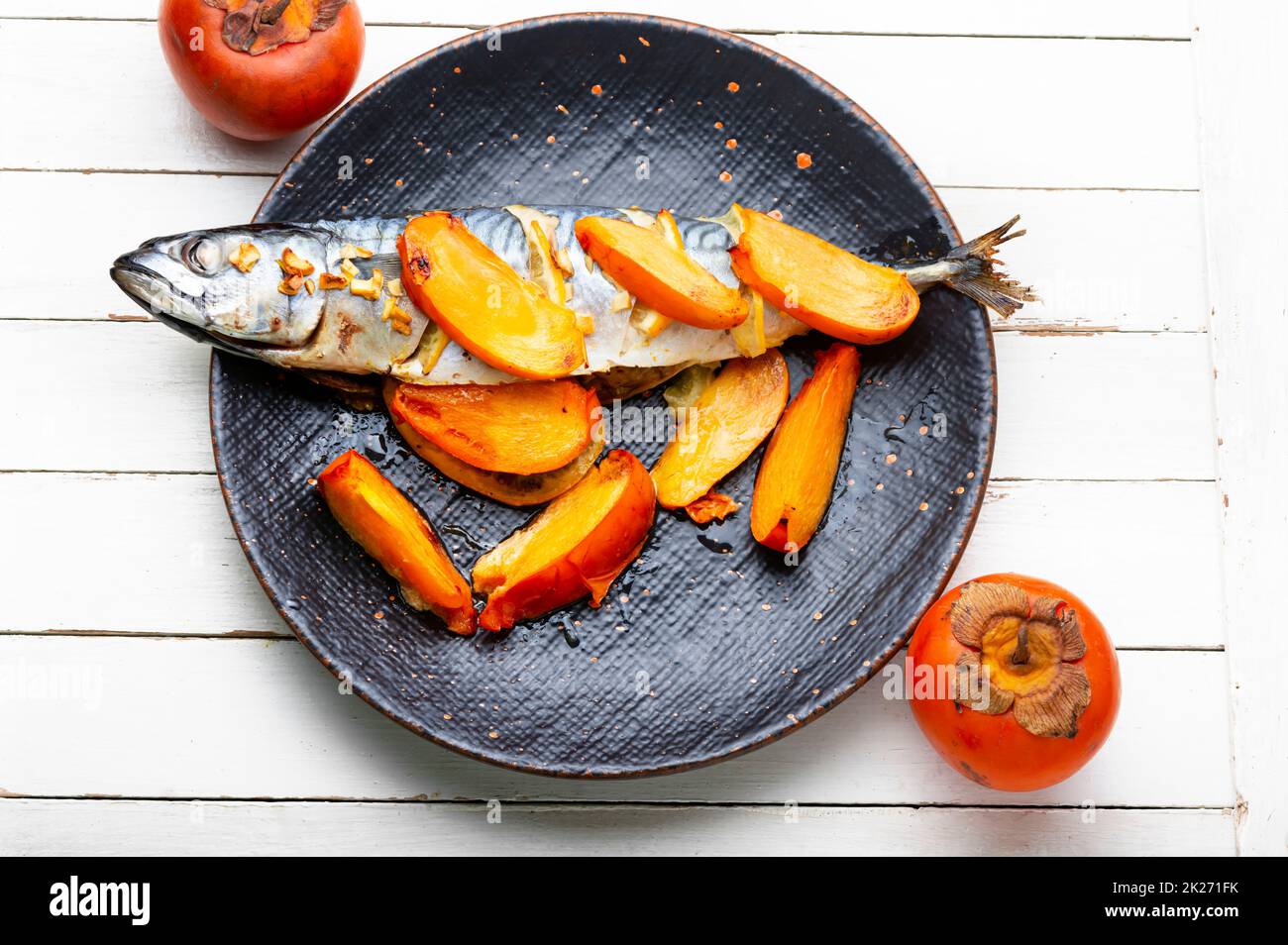 Grilled mackerel fish with persimmon Stock Photo - Alamy