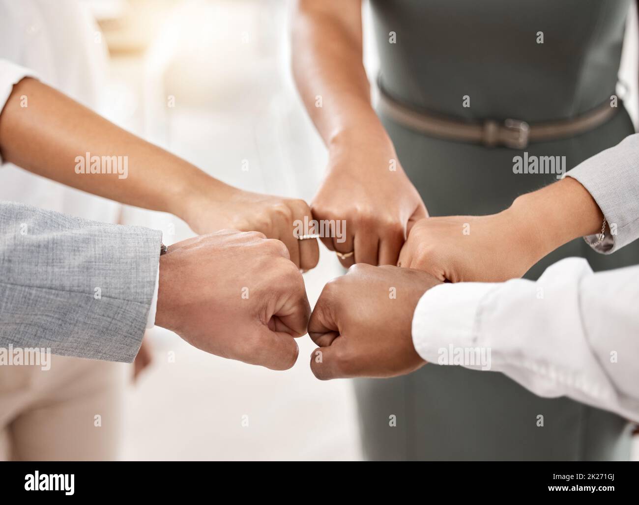 Diversity, business team and fist bump in office with support, team building and employee ...