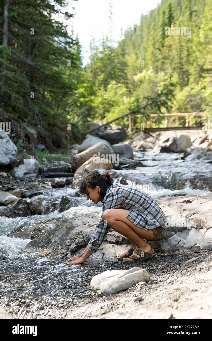 Female hand water woods hi-res stock photography and images - Alamy