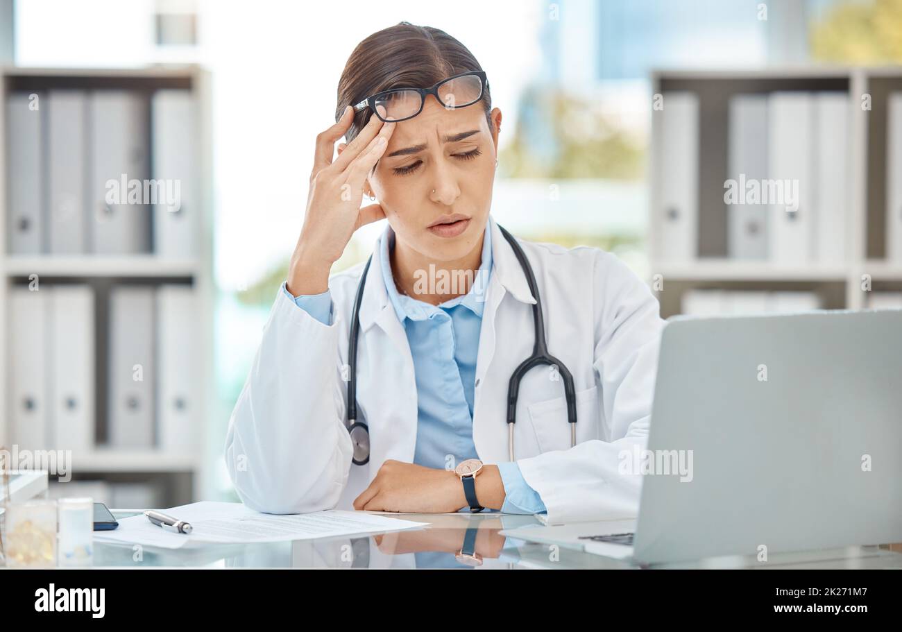 Headache stress, doctor burnout and sad nurse working on laptop in work ...