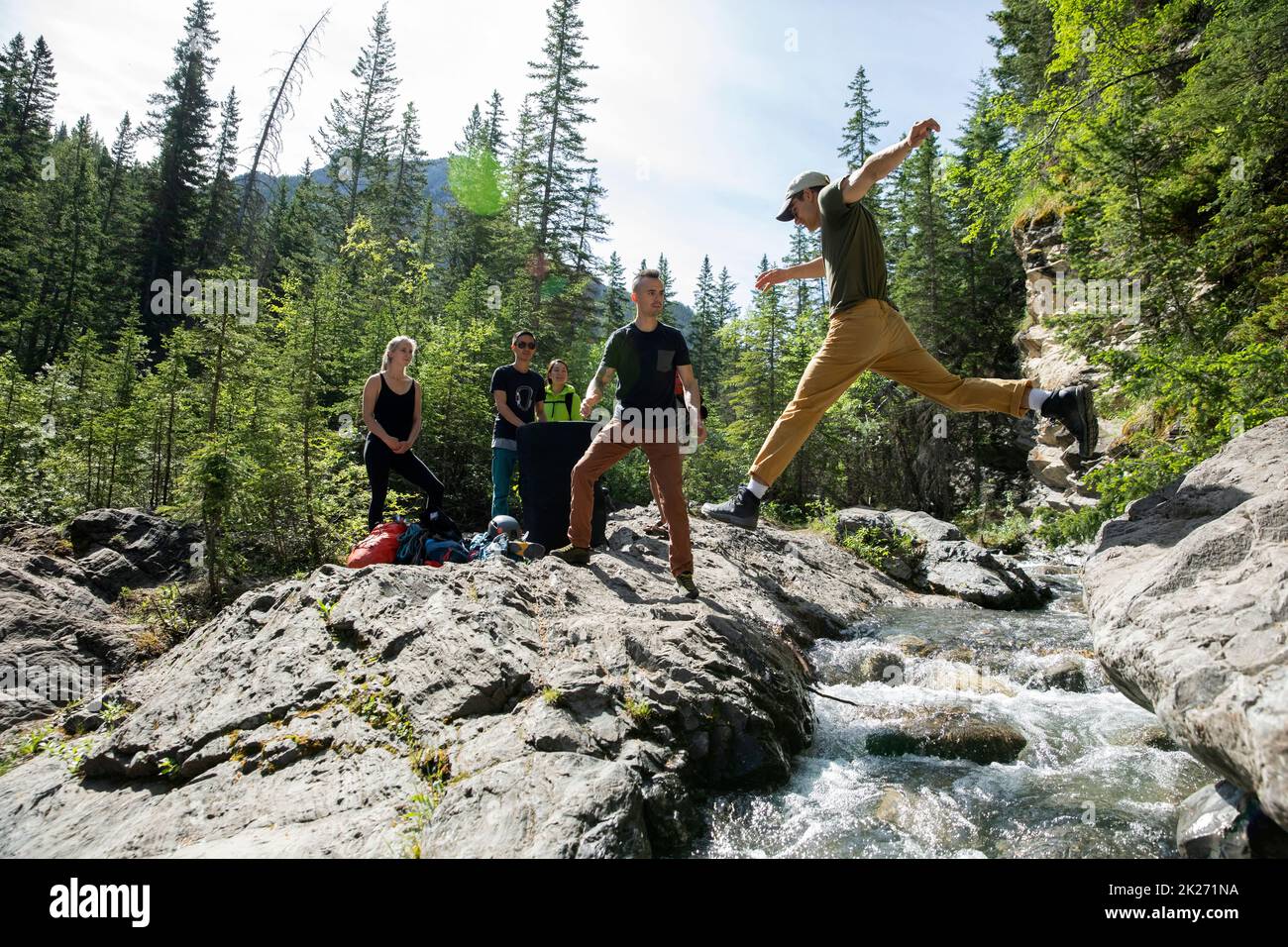 Jumping over a stream of water hi-res stock photography and images - Alamy