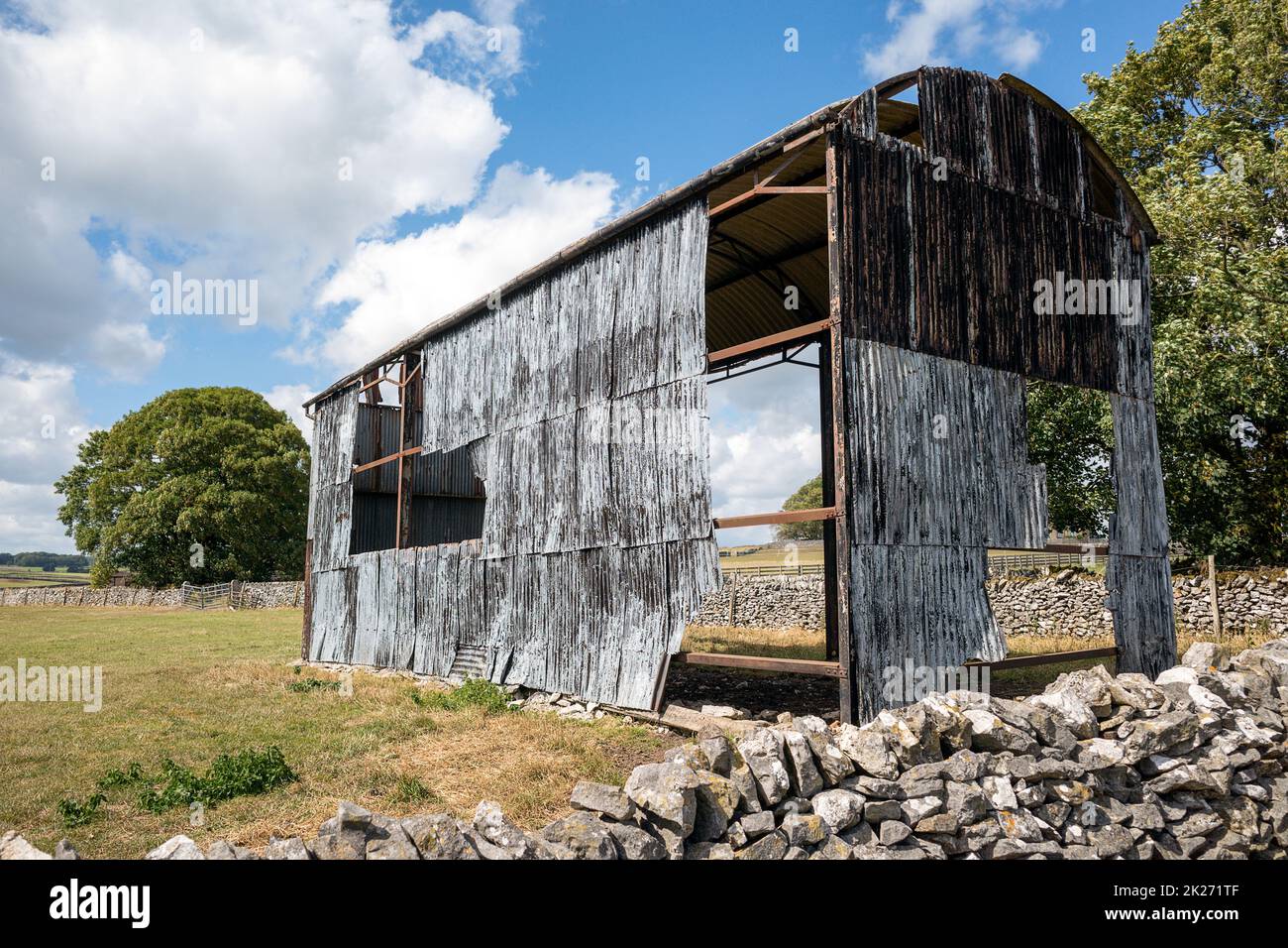 derelict old weather worn corrugated metal farmers barn in the country ...