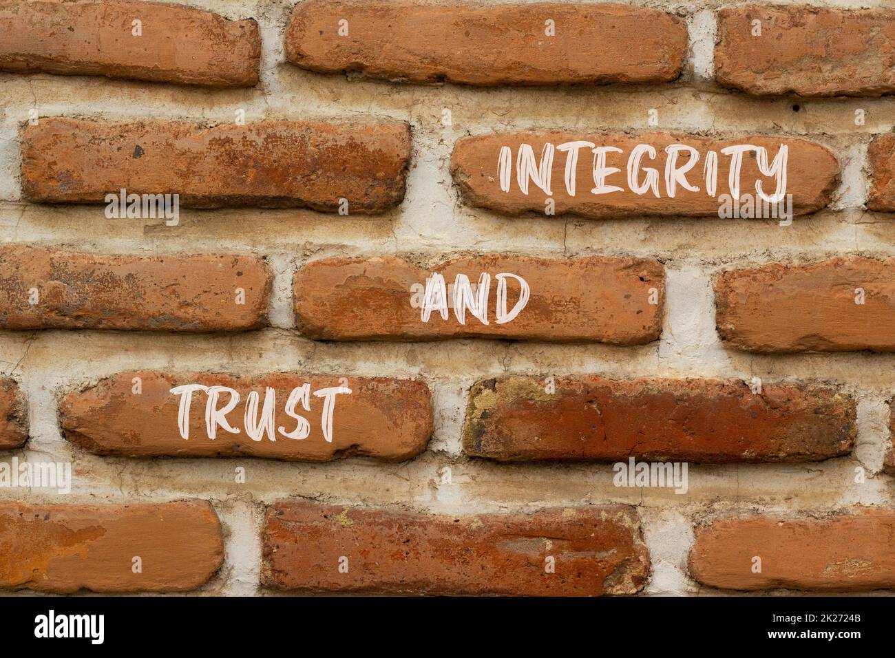 Trust and integrity symbol. Concept words Trust and integrity on red ...