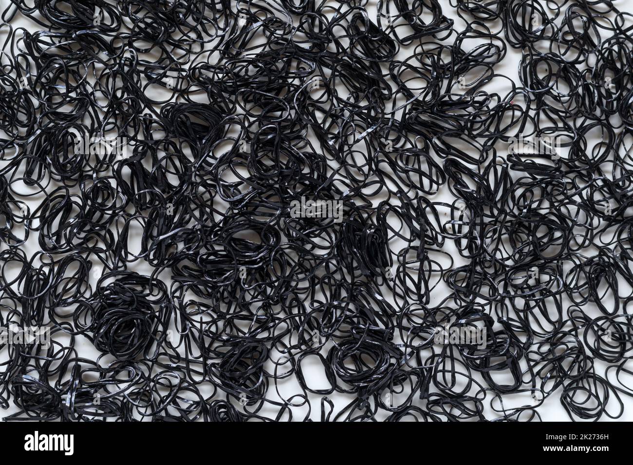 black rubber band background with lots of black on the floor is the ...