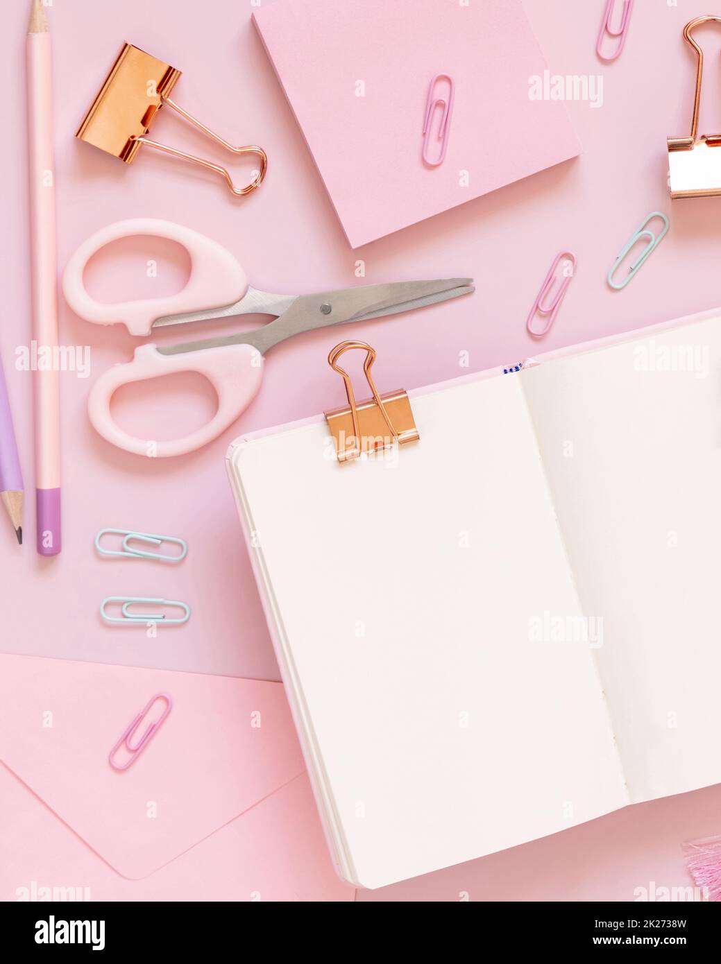 Opened notebook and Pink school girly accessories on pastel pink Top ...