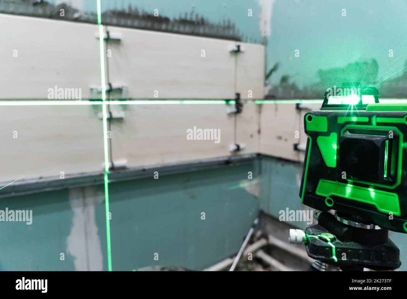 Construction and repair of walls in a new building.Laying wall tiles ...