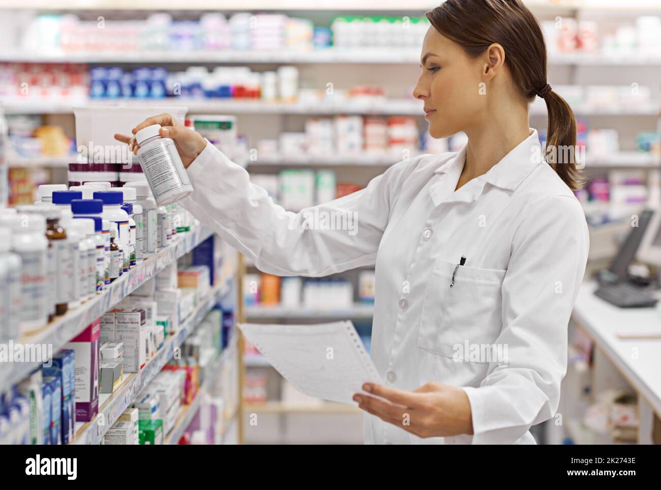 Chemist checking drugs shelf hi-res stock photography and images - Alamy