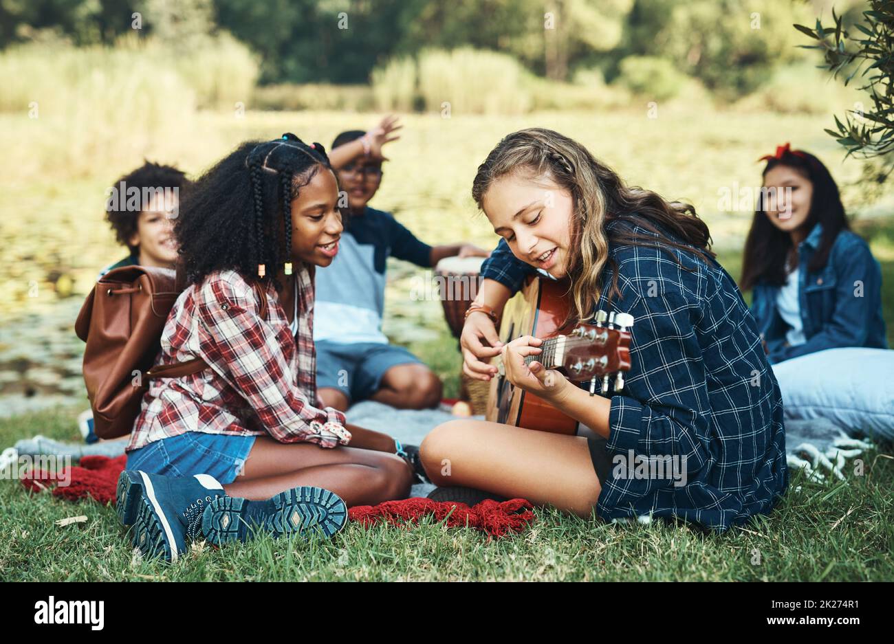 Boy playing musical instruments hi-res stock photography and images - Alamy