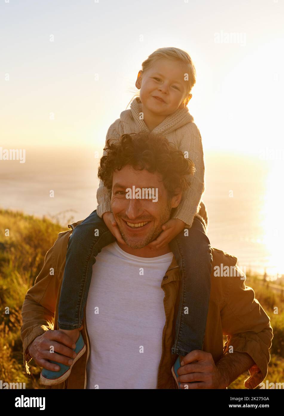Dad's got the ride covered. Portrait of a father giving his little girl a ride on his shoulders ...