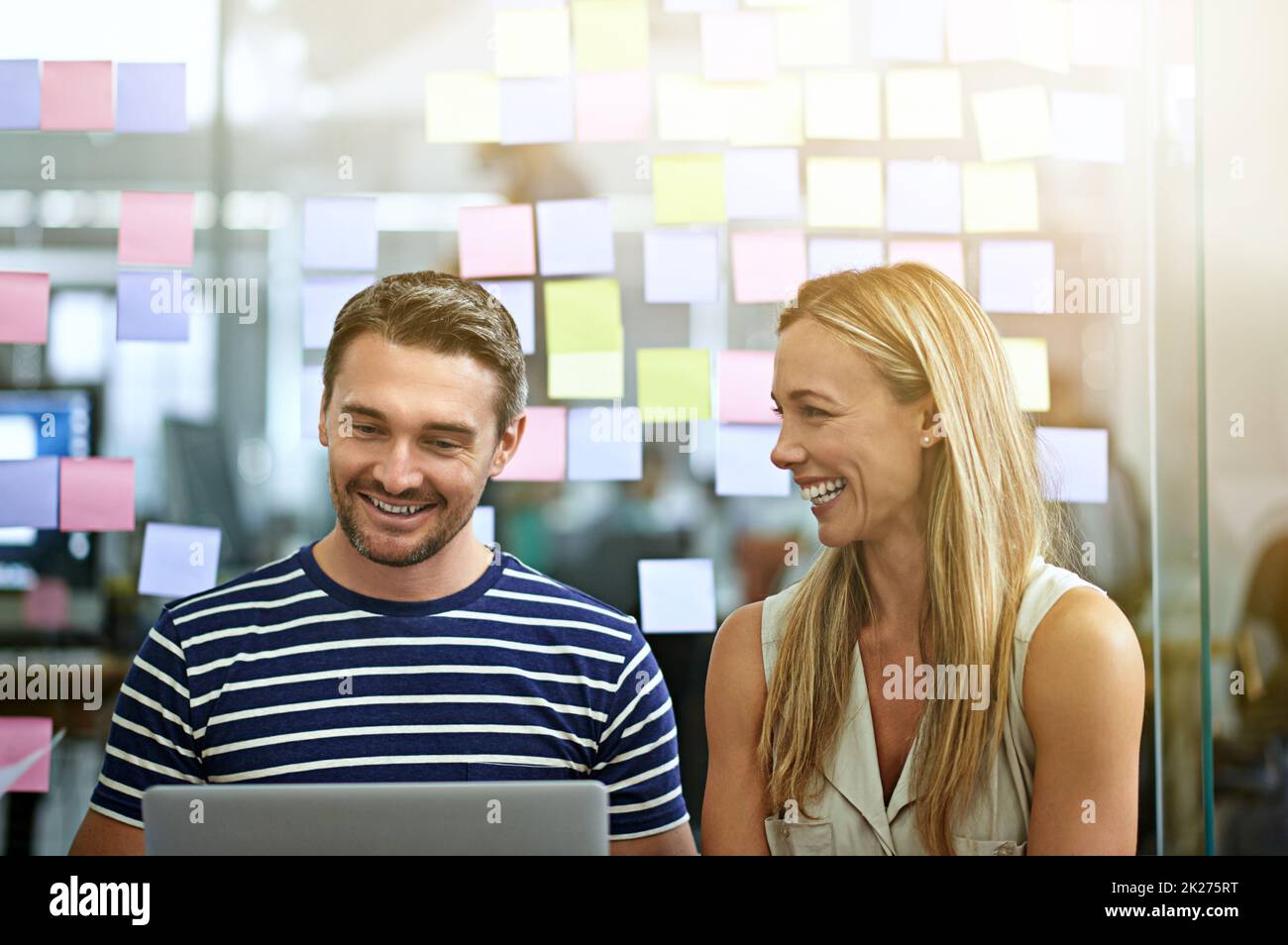Taking pride in their project. Cropped shot of two business colleagues ...