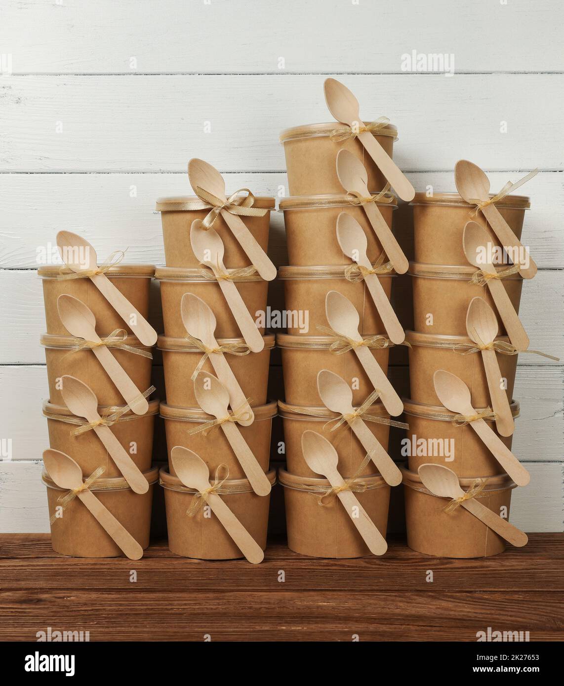 Stack of brown paper cups with dessert Stock Photo - Alamy