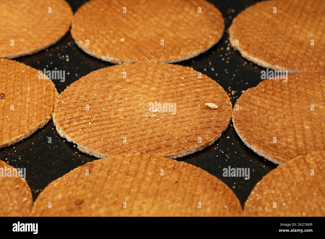 Dutch stroopwafel waffles cookies on baking pan Stock Photo - Alamy