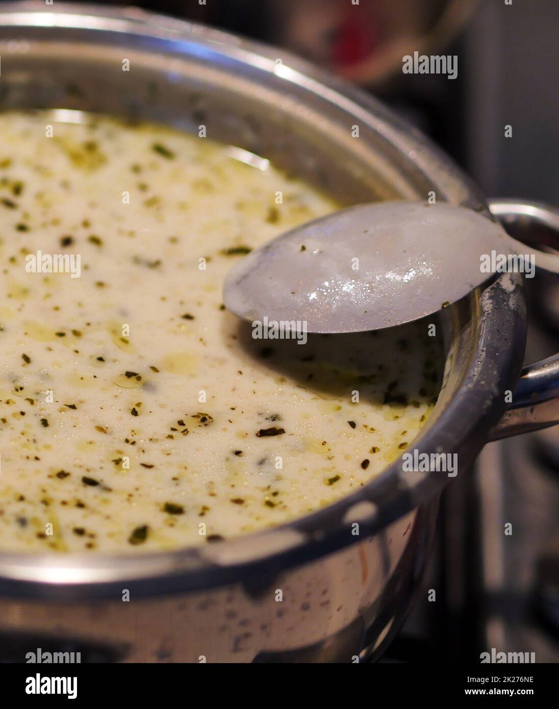 Boiling yoghurt soup on a freshly cooked stove, very hot yoghurt soup ...