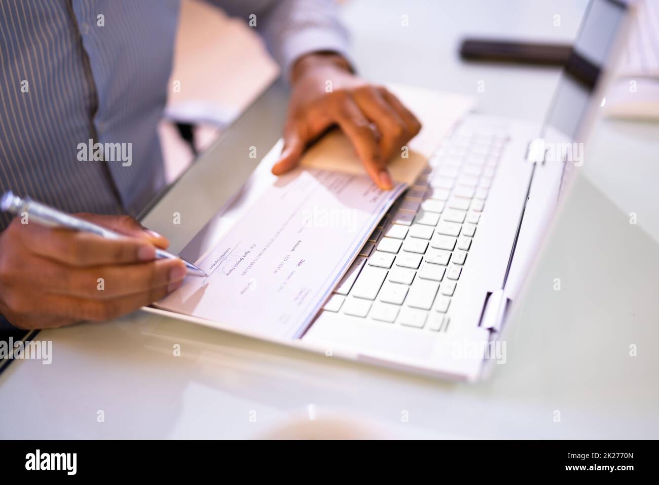 Writing Payroll Compensation Check Stock Photo - Alamy