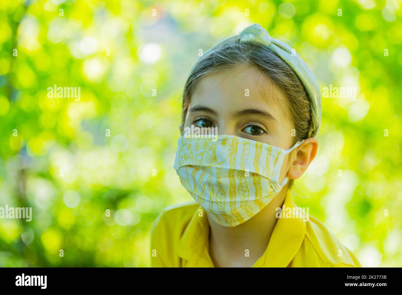 Little girl with mask Stock Photo - Alamy