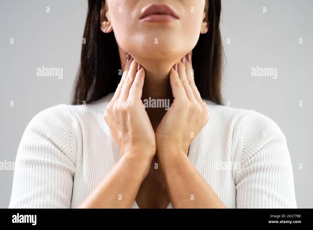 Sore Neck And Throat. Woman Pain Stock Photo - Alamy