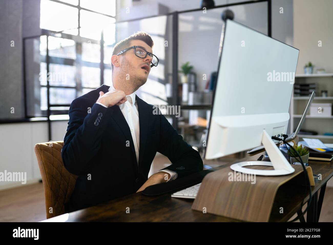 Uncomfortable businessman hi-res stock photography and images - Alamy