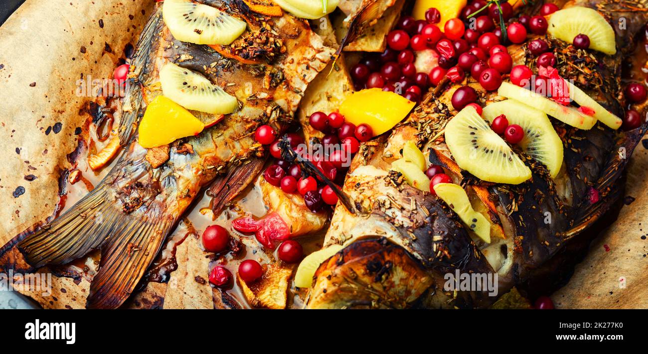 Delicious carp fried with kiwi and mango Stock Photo - Alamy