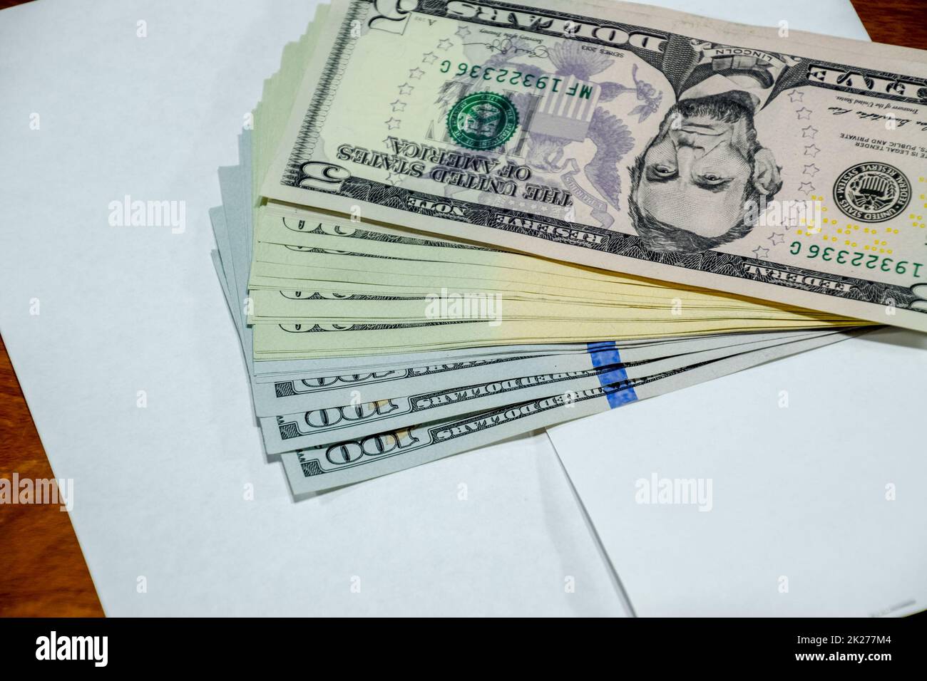Dollars on table with an envelope. Money in an envelope. U.S. dollars ...
