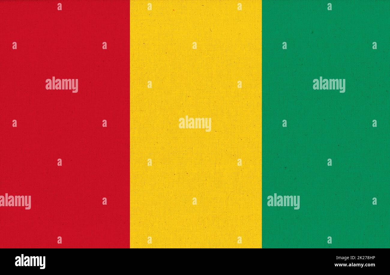 flag of Guinea. National flag on fabric surface Stock Photo - Alamy