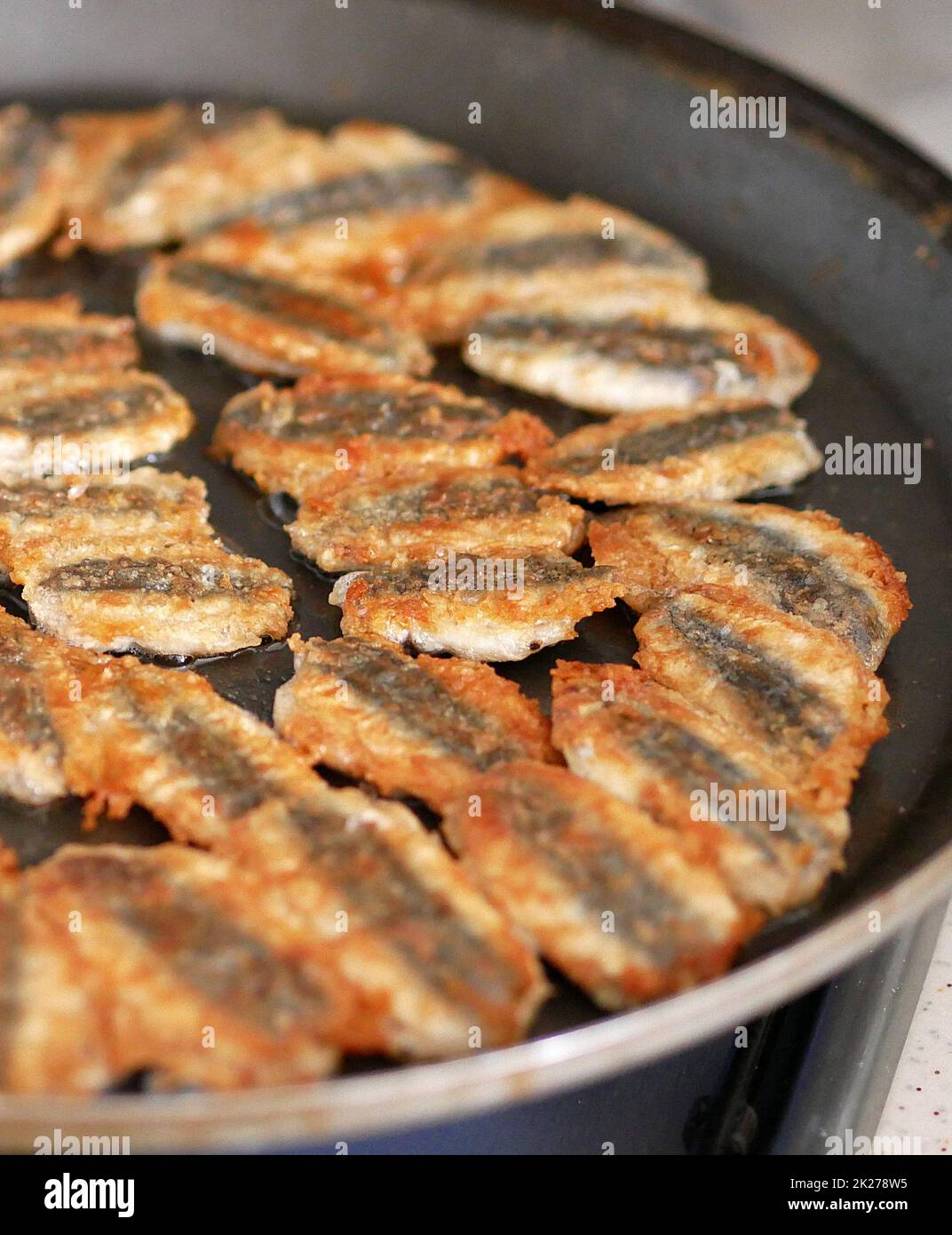 Fried anchovy in oil hi-res stock photography and images - Alamy
