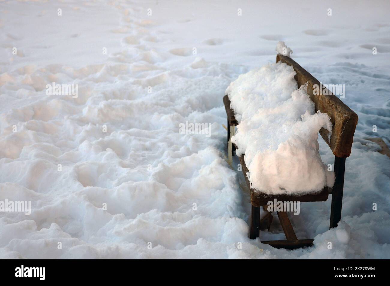 a lot of snow fell on the sitting bench, snow and sitting bench Stock ...