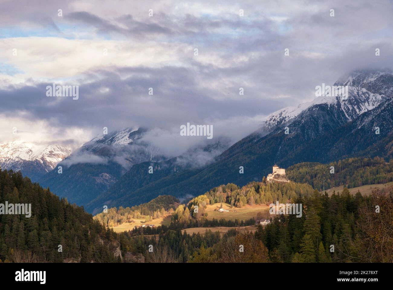 Tarasp castle lights up in evening light Stock Photo - Alamy