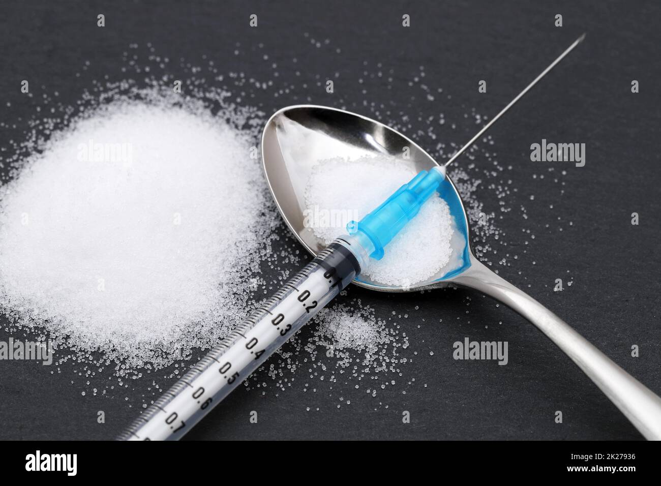 Drug injection syringe and cooked heroin on black background Stock ...