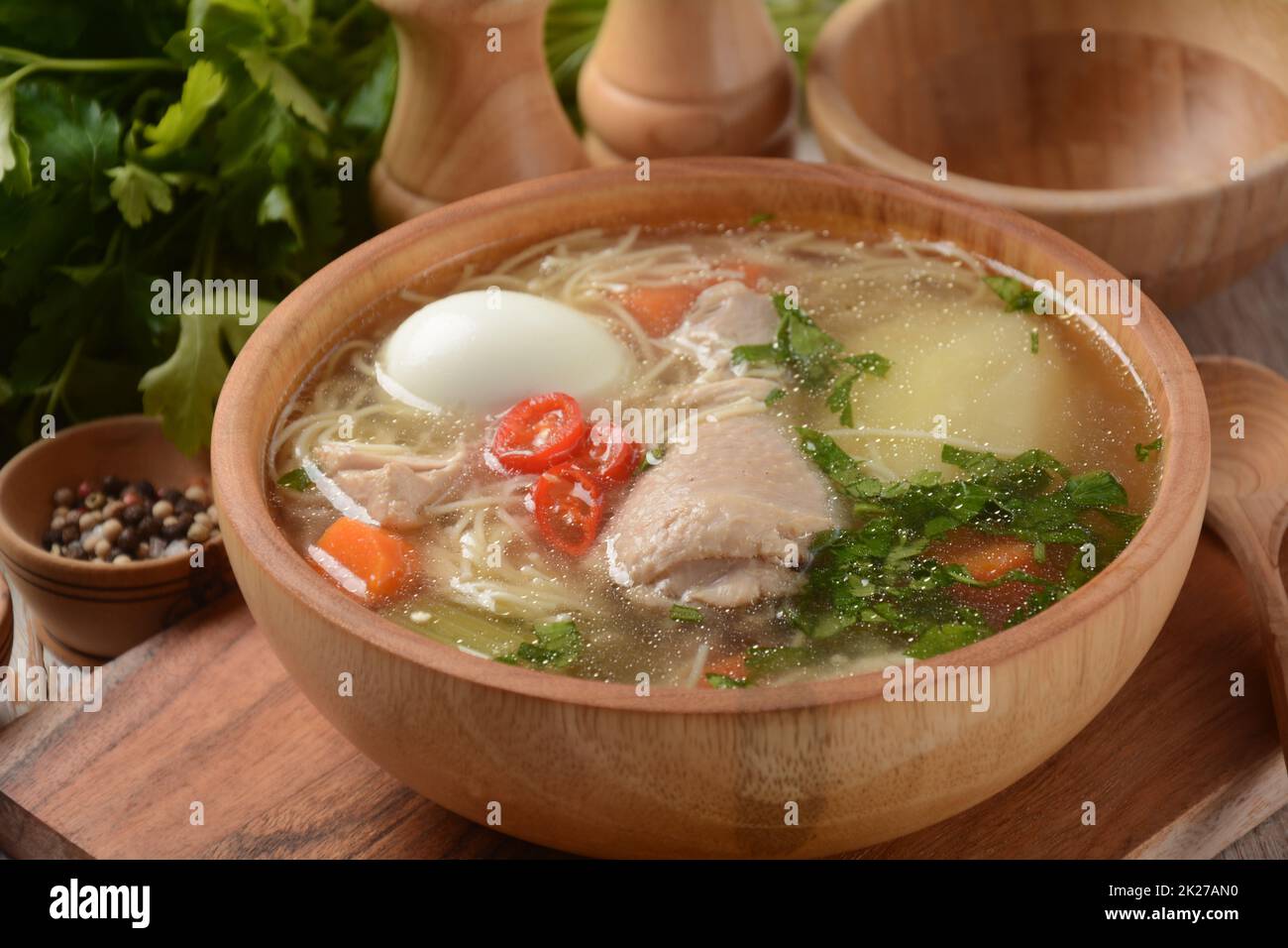 South American Caldo de Gallina chicken noodle soup with boiled egg and ...