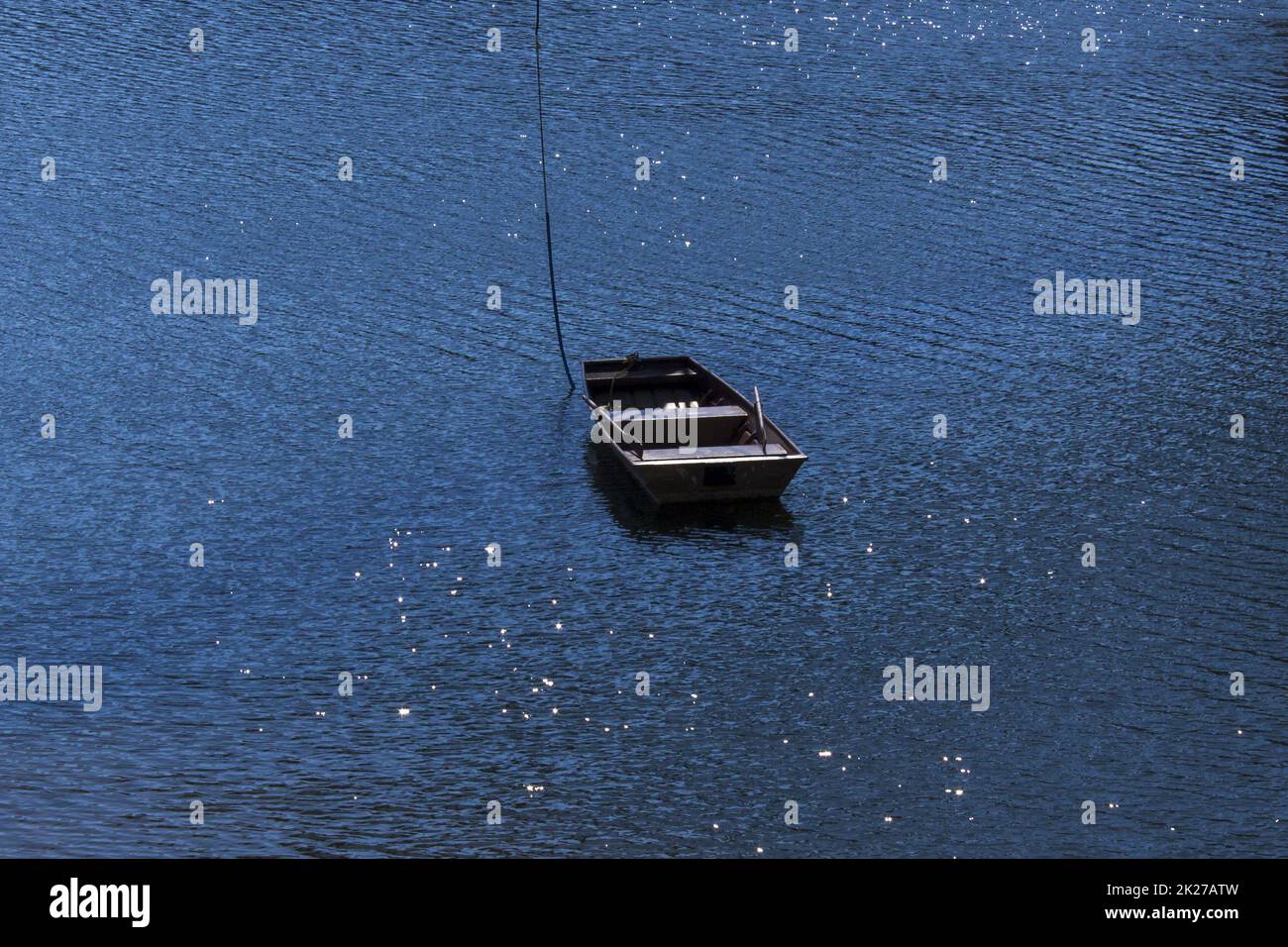 Little boat in the middle of the dam 2 Stock Photo - Alamy
