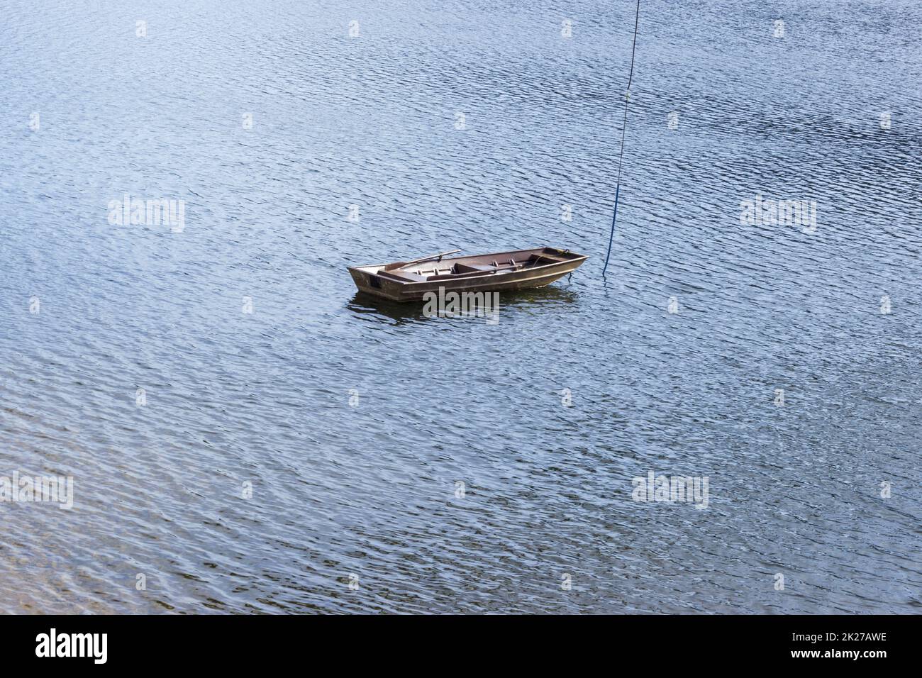Little boat in the middle of the dam Stock Photo - Alamy
