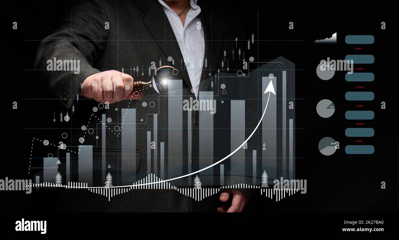 man in a black shirt stands in front of a holographic graph with ...