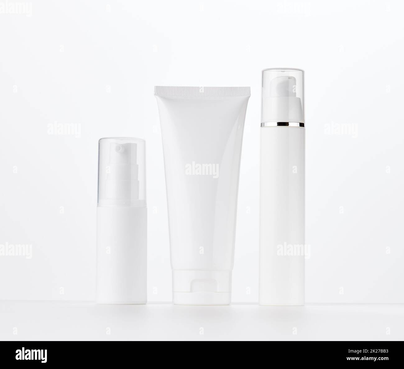 bottle, empty white plastic tubes for cosmetics. Packaging for cream ...