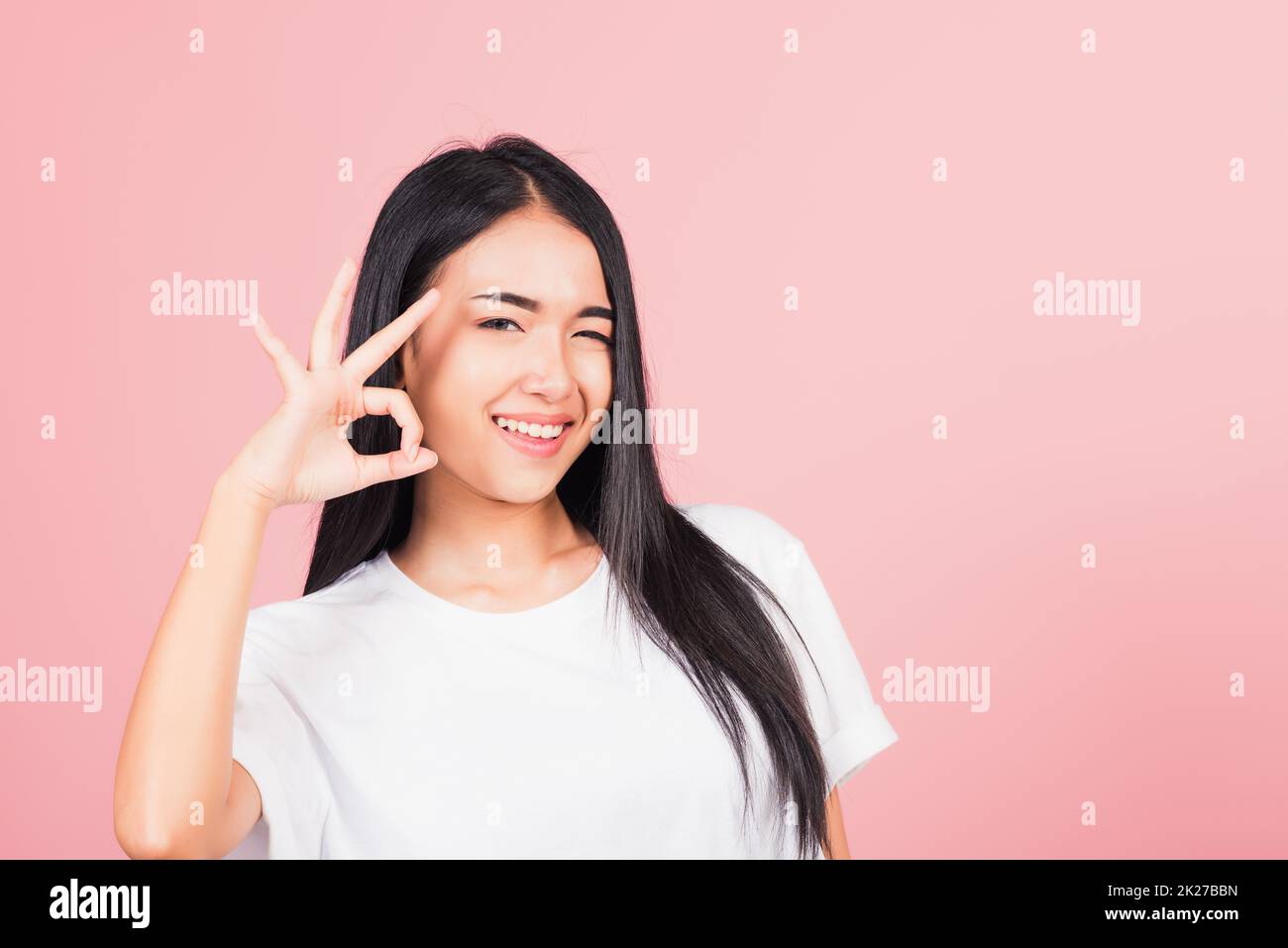 woman made finger OK symbol sign gesture wink eyes to agree Stock Photo ...