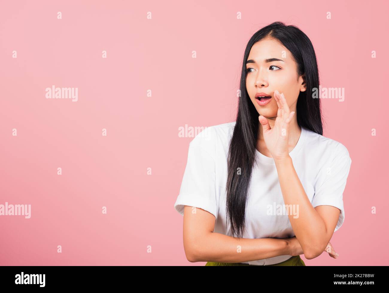 woman teen standing hand on mouth talking whisper secret rumor Stock ...