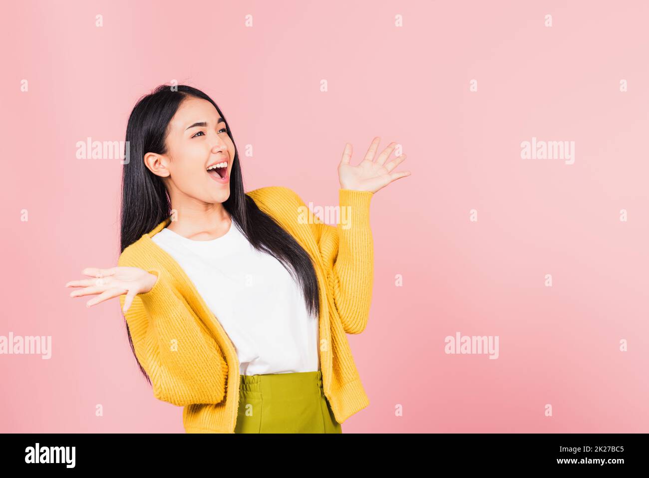 woman standing winning and surprised excited screaming Stock Photo - Alamy