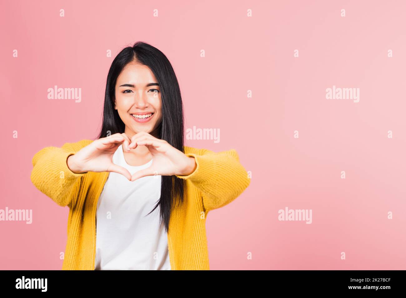 woman smile make finger heart gesture figure symbol shape sign Stock ...