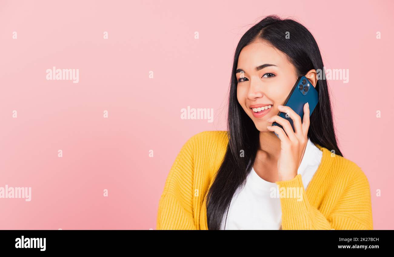 beautiful young woman smile talking by smartphone Stock Photo - Alamy
