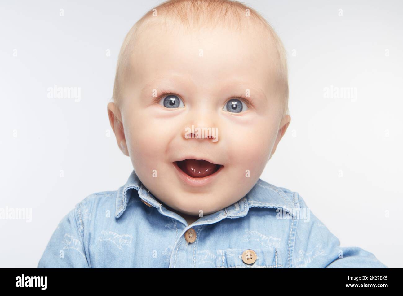 The innocent face of a little baby expresses such a joyful and charming ...