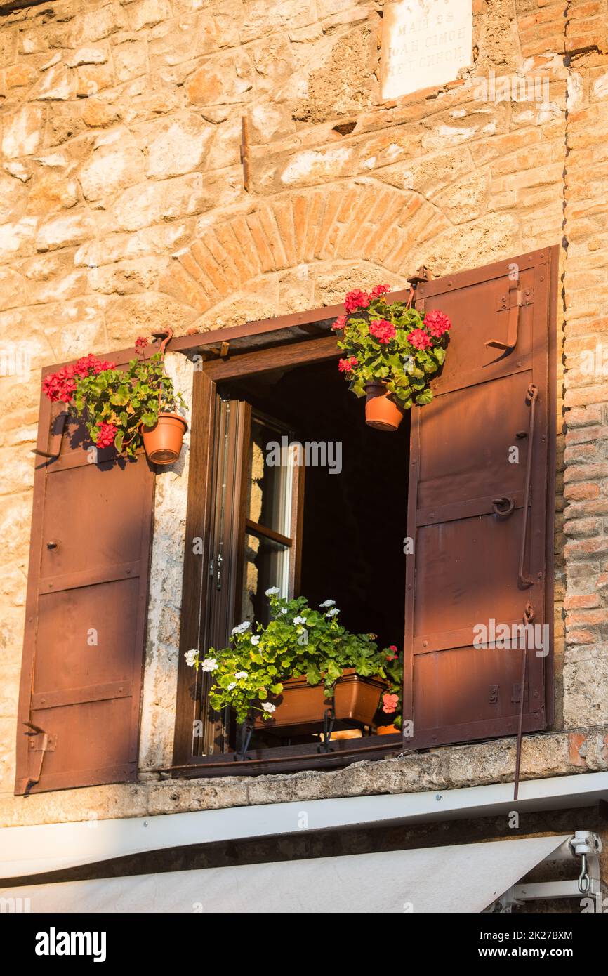 Open window with shades and flowers Stock Photo - Alamy