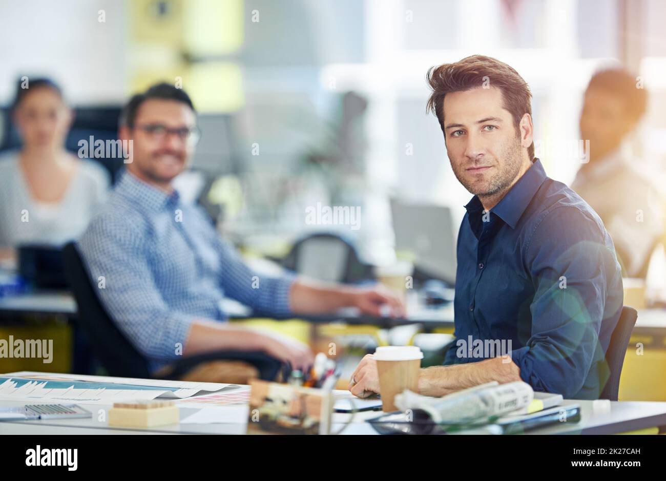 Success is one more project away. Portrait of a group of coworkers ...