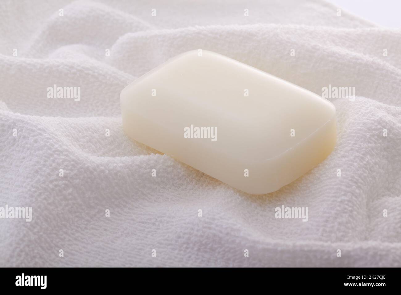 Hand-made soap and sea salt on grey bamboo mat Stock Photo - Alamy