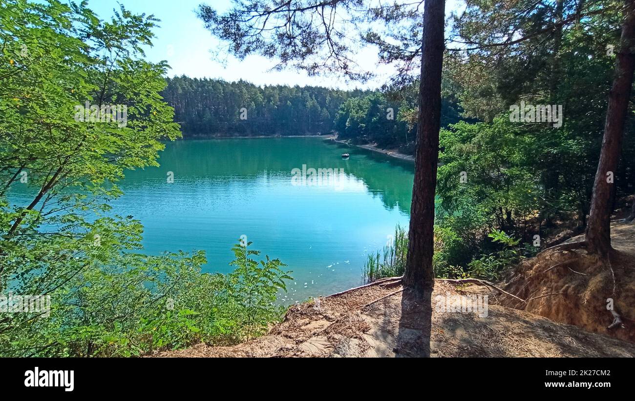 Forest lake with emerald water. Beautiful water panorama Stock Photo ...