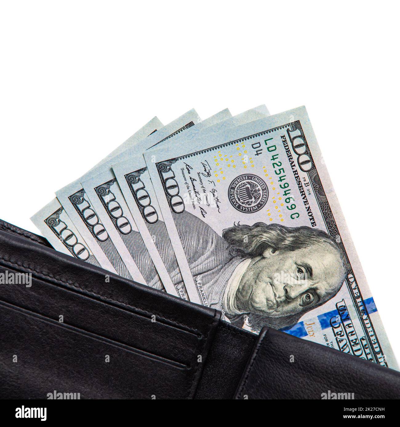 A black wallet with dollars in it on a white background Stock Photo - Alamy