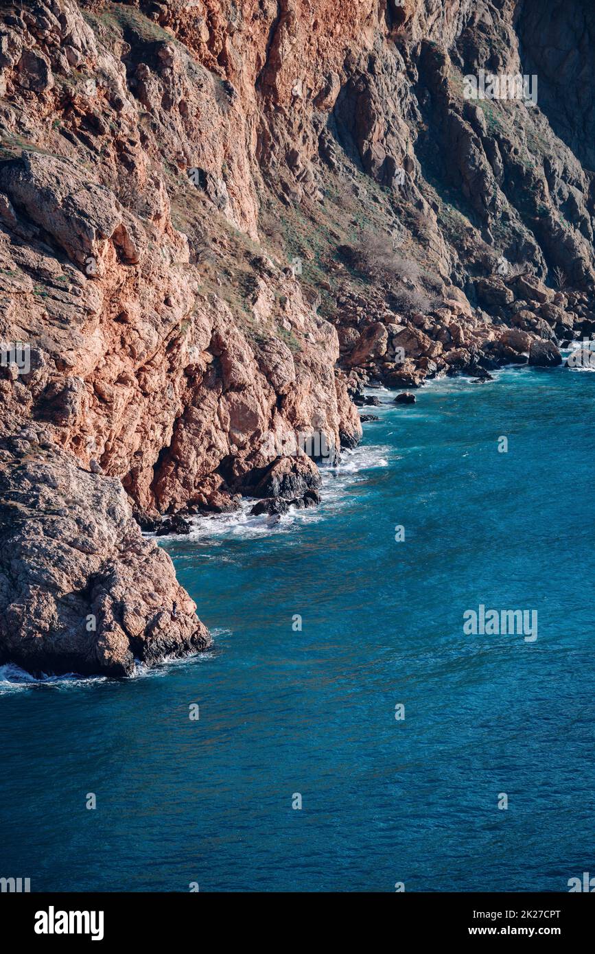 Landscape sea and rocks. The sea is an amazing blue color with ...