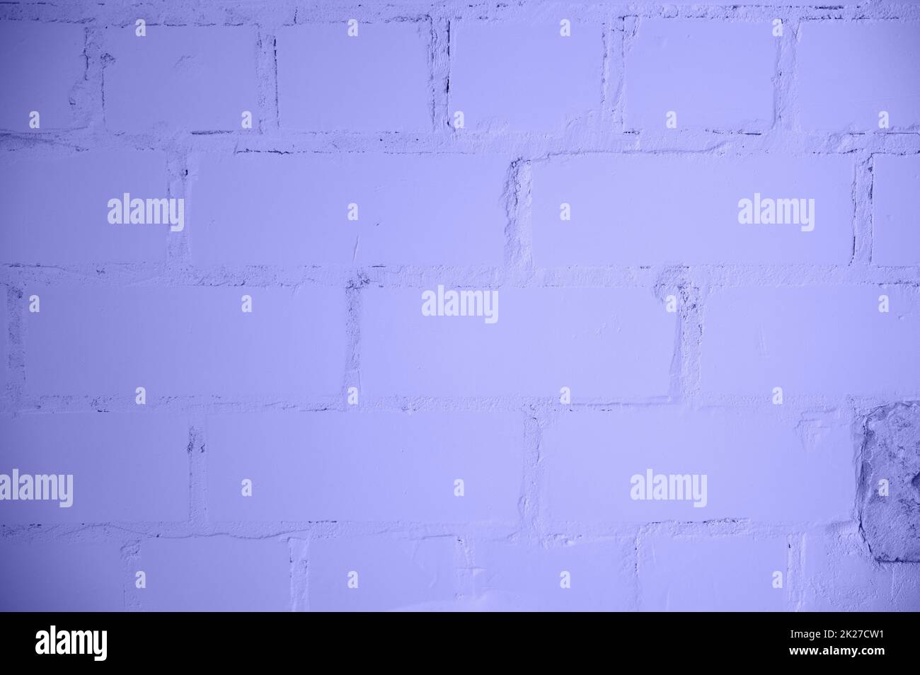 Brick wall colored in trendy violet color Stock Photo - Alamy